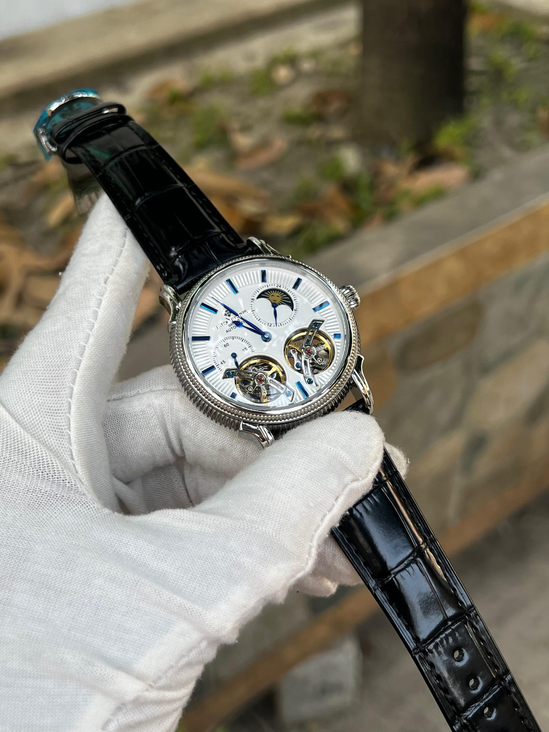 Patek Philippe watch with a white dial, two tourbillon-style open heart ...